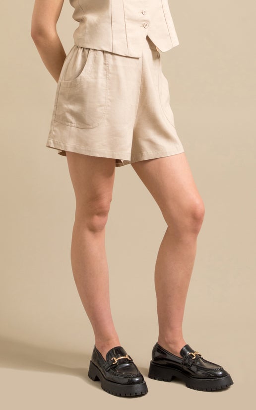 Shop our Curved Pocket Elastic Waist Shorts in Natural | Pagani